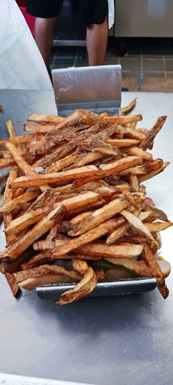 These hand-cut fries aren't just a side dish—they're the golden, crispy co-stars of the Gene & Jude's experience.