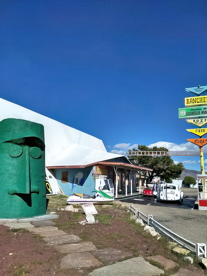 The visitor center's colorful exterior complements its green guardian, creating a roadside oasis that beckons weary travelers.