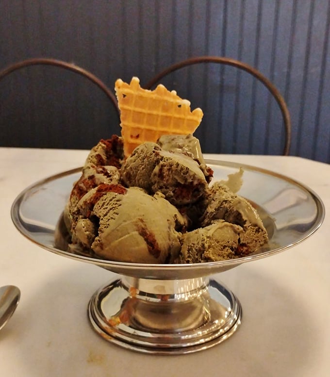 Ice cream served in a silver dish with a waffle garnish – proving that sometimes the classics don't need reinvention, just perfect execution.