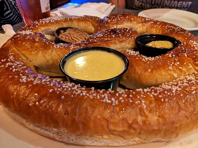 This isn't just a pretzel—it's carb architecture. A golden-brown behemoth with dipping sauces that demands to be shared (but you won't want to).