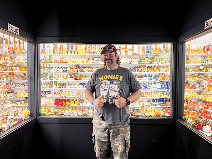A visitor gives two enthusiastic thumbs up against a backdrop of food-themed shakers. His shirt says it all: "Homies" indeed!