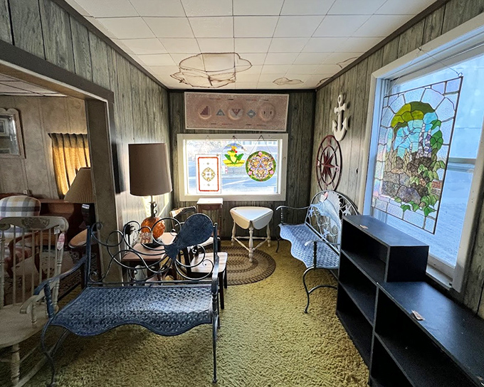 Iron furniture and stained glass create a maritime meditation space. The perfect spot to contemplate life's big questions—like whether you need that compass rose.