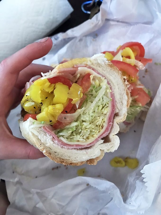 Layer upon layer of Italian meats, cheese, and veggies—architectural genius that would make Frank Lloyd Wright weep with joy.