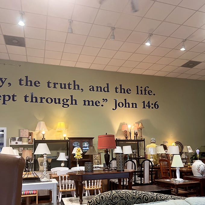 The lamp section glows with potential. Biblical inspiration adorns the walls while practical illumination fills the shelves below.