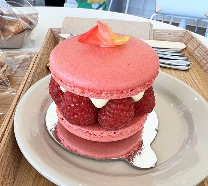 The raspberry macaron cake—where "too pretty to eat" meets "too delicious not to." Those fresh berries are nature's little rubies.