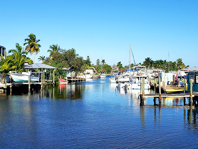 Boats bob gently in Matlacha's crystal waters. This working marina showcases Florida's enduring relationship with the sea.