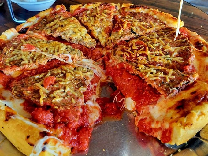 This loaded deep dish creation looks like someone took all your pizza dreams and made them deliciously real.