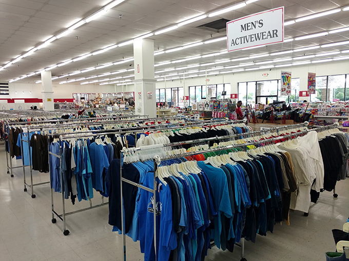 The men's activewear section: where workout intentions meet affordable reality in a sea of blue and practical possibilities.