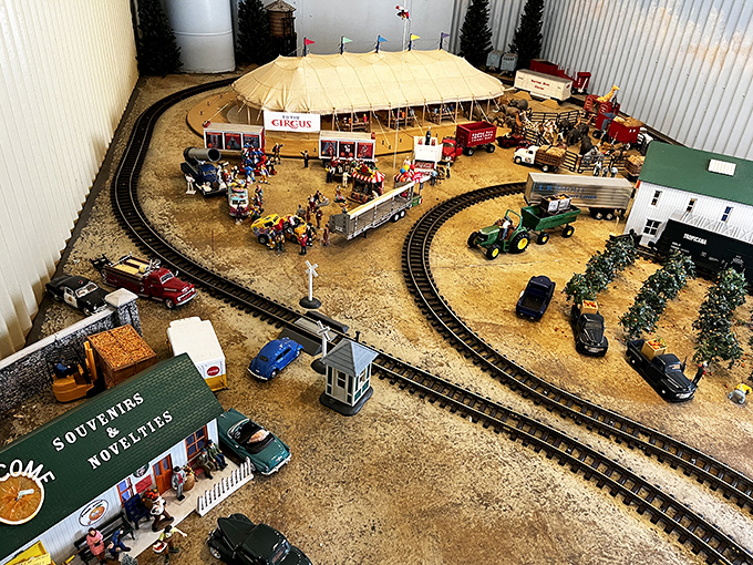 This miniature world captures the magic of trains in perfect detail – a tiny circus, diminutive cars, and pocket-sized buildings creating an entire universe in miniature.
