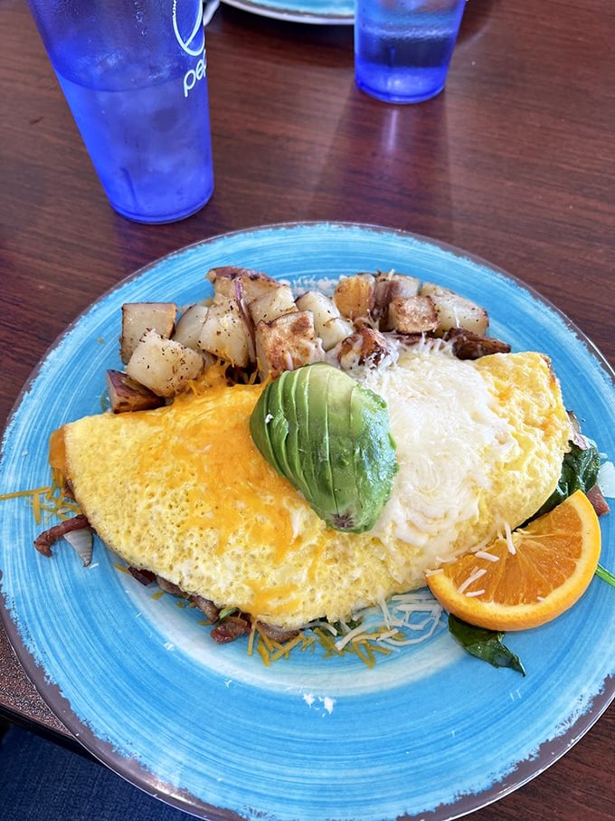 An omelet bursting with enough filling to make a calzone jealous – this is breakfast with ambition.