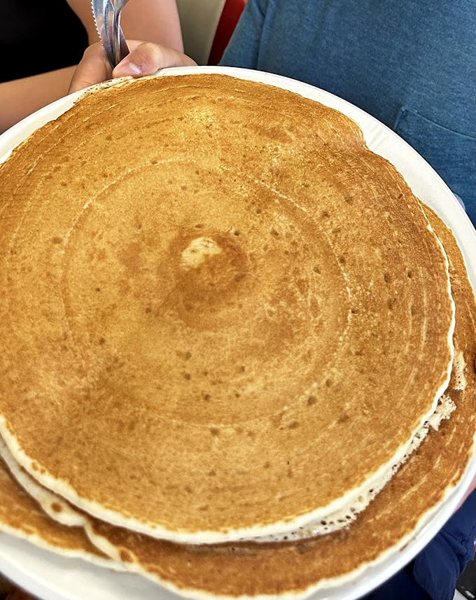Pancakes so perfectly golden they could win medals—the kind that make you wonder if your grandmother snuck into the kitchen.
