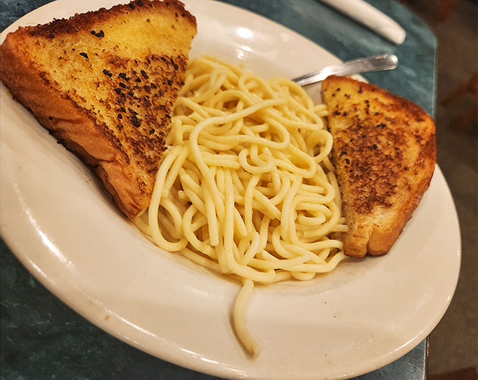 Sometimes pasta doesn't need to be complicated—just perfectly cooked, simply served, and paired with buttery garlic toast for maximum comfort.