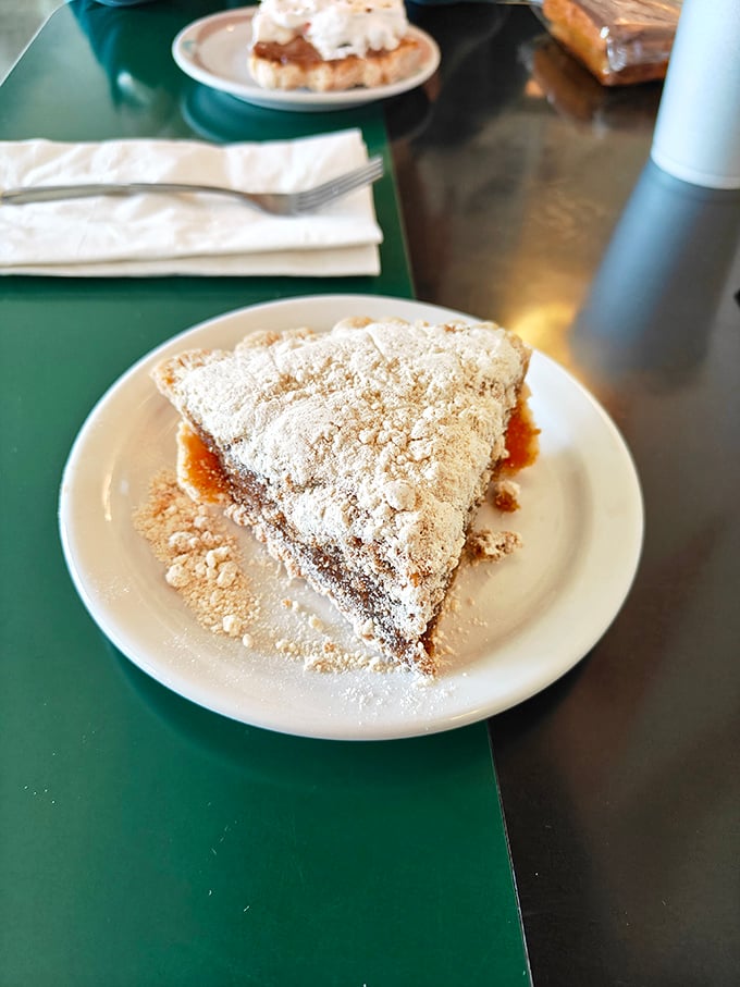 That pie slice stands tall and proud, like it knows it's about to make someone's day infinitely better.