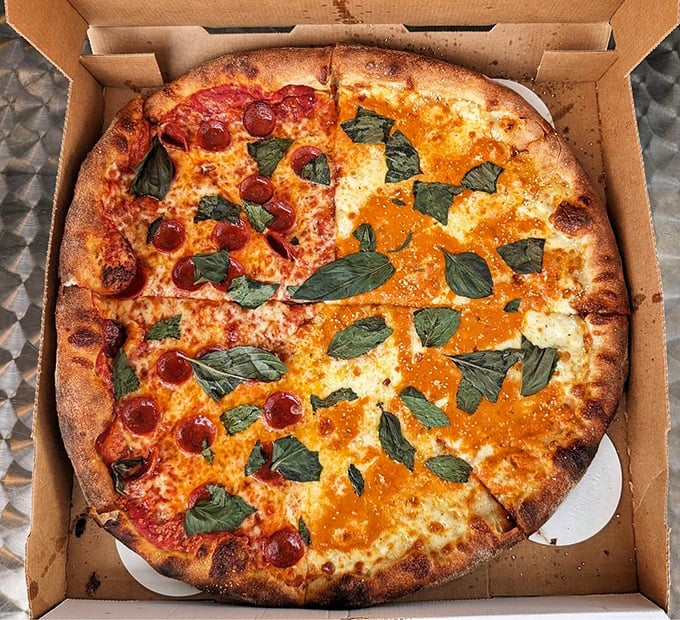 Half pepperoni, half margherita – the pizza equivalent of having your cake and eating it too, with those fresh basil leaves adding nature's confetti. za