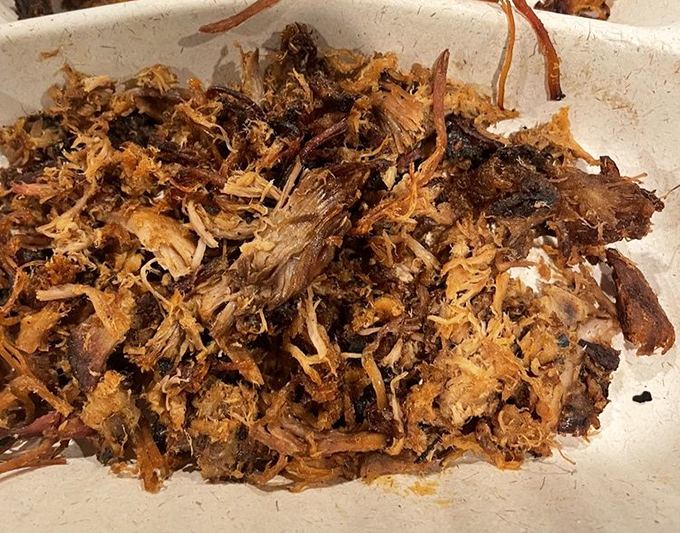 Pulled pork that doesn't need Instagram filters to look good. Each strand tells the story of slow-smoking and careful handling—the barbecue equivalent of a love letter.
