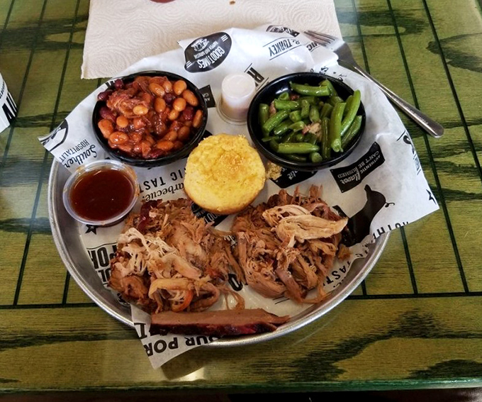 The pulled pork plate—where meat, beans, and greens come together like the world's most delicious family reunion. Don't forget the cornbread!