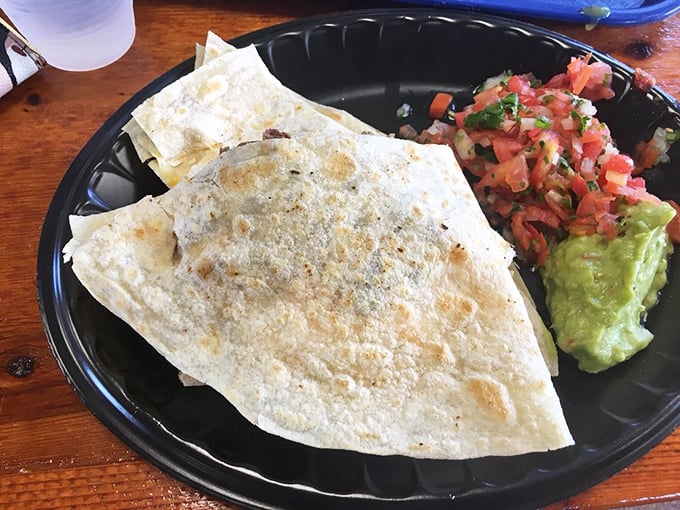 A quesadilla so stuffed with fresh lettuce it's practically wearing a green hat—comfort food dressed for a fiesta.