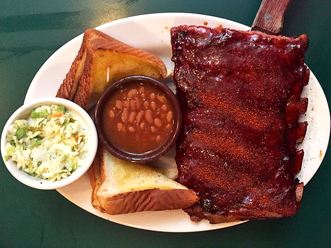 Ribs that have achieved barbecue nirvana – perfectly glazed, served with Texas toast and sides that know their supporting role in this meaty drama.