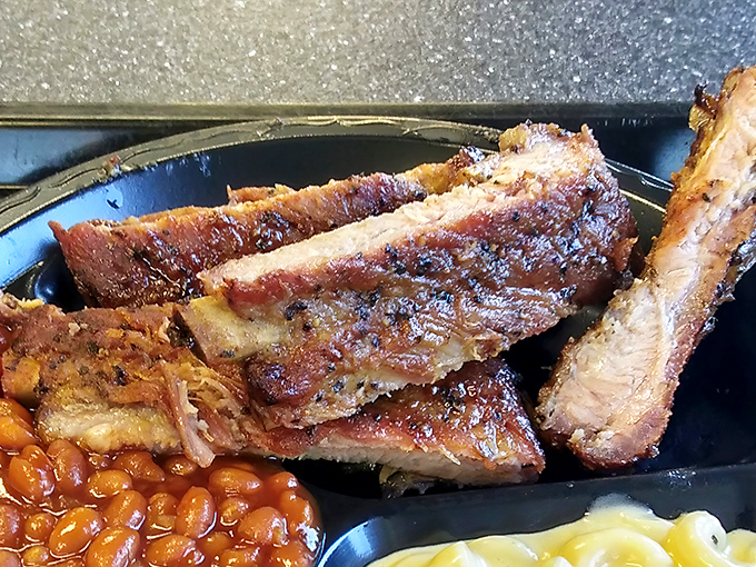 These ribs strike the perfect balance—tender enough to yield to your bite, yet firm enough to maintain their dignity. Barbecue architecture at its finest.