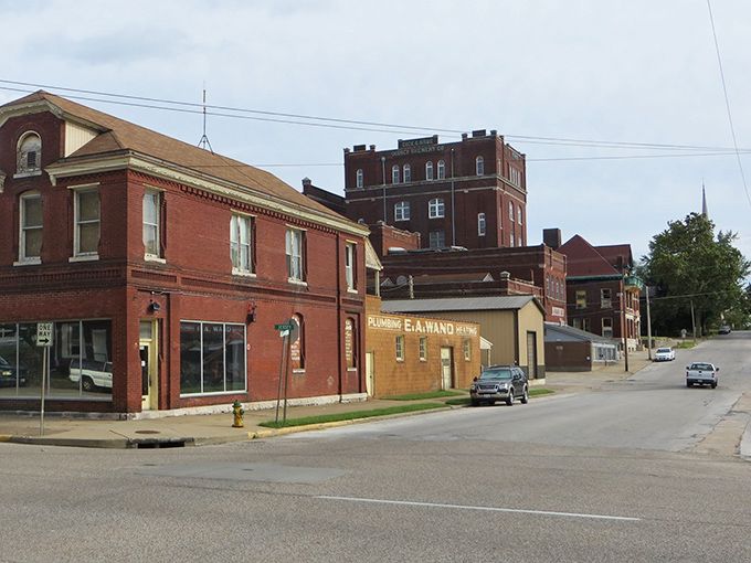 Small-town streetscapes where brick buildings tell stories of commerce, community, and countless "remember whens" over coffee at the corner diner.