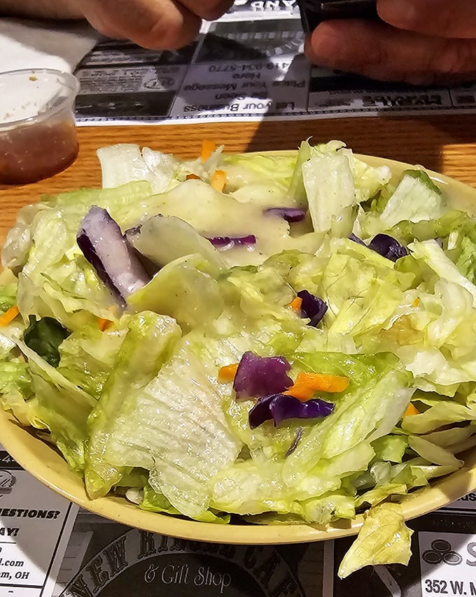Even the salads here mean business – fresh greens that actually make you forget about the ribs.