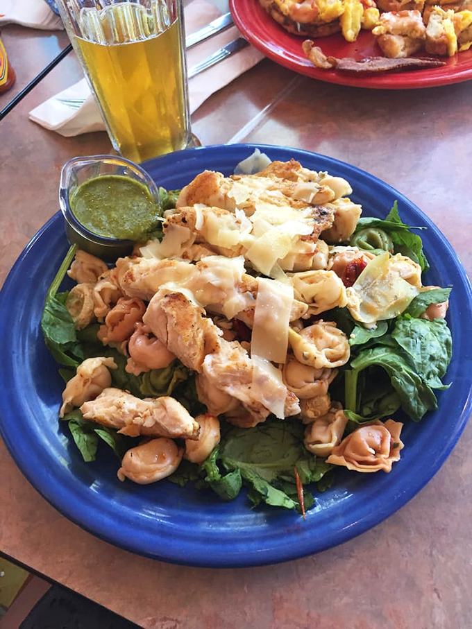 Not just another salad—this vibrant bowl combines grilled chicken, fresh greens, and house-made dressing in a symphony of textures and flavors.
