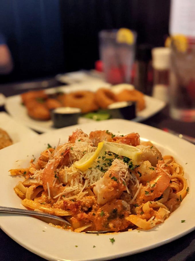Pasta that doesn't just carry seafood—it celebrates it. Those shrimp look like they're doing a victory lap in that creamy sauce.