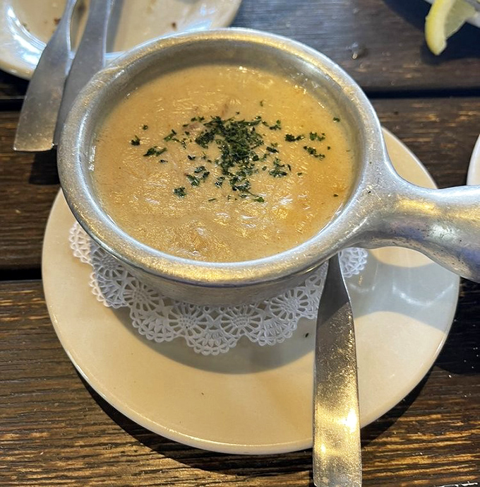The she-crab soup arrives like liquid velvet in a silver chalice—rich, decadent, and worthy of its own Instagram account.