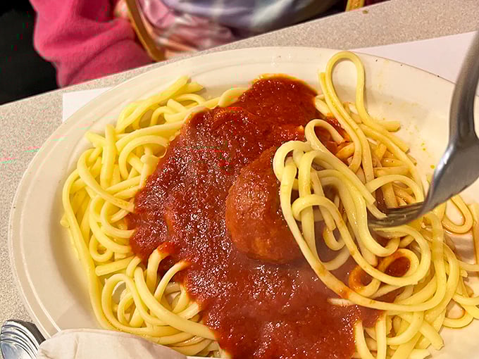 Spaghetti so perfectly sauced it makes you wonder why anyone would ever attempt to cook it at home. Simple, honest, and utterly satisfying.