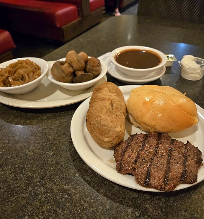 Perfectly grilled steak with fresh bread – proof that some combinations never go out of style.