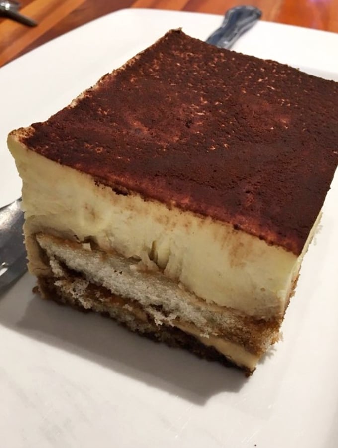 Tiramisu so perfectly layered it deserves its own geological survey. The cocoa-to-mascarpone ratio here is what mathematicians call "the golden delicious."