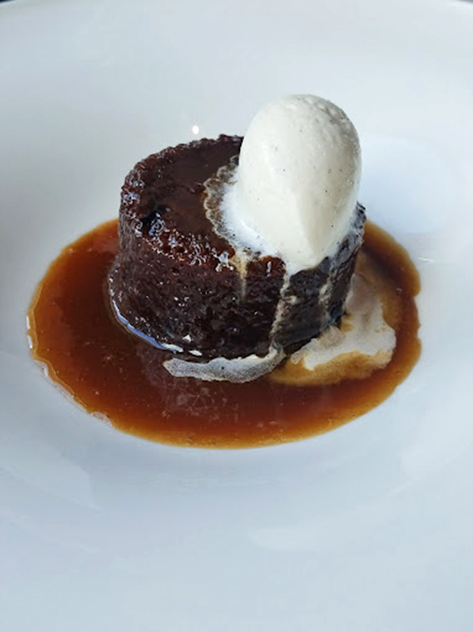 Sticky toffee pudding that doesn't just satisfy your sweet tooth—it throws a party for it. That vanilla ice cream is melting almost as fast as my resolve.