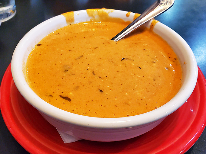 A bowl of sunshine masquerading as tomato soup. The velvety texture and rich color promise comfort with each spoonful—winter blues, consider yourself banished.
