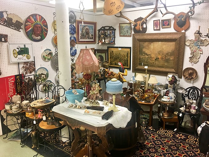 A booth that looks like your eccentric great-aunt's living room exploded in the best possible way – lamps, artwork, and curiosities creating organized chaos.