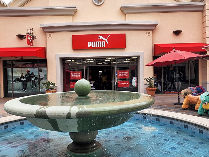 Puma's bright red storefront at Carlsbad Premium Outlets stands out like a beacon of sporty style. Those aren't just sneakers – they're steals!