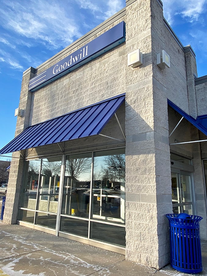 Goodwill's modern stone exterior and blue awnings create a shopping experience that feels surprisingly upscale for secondhand finds.