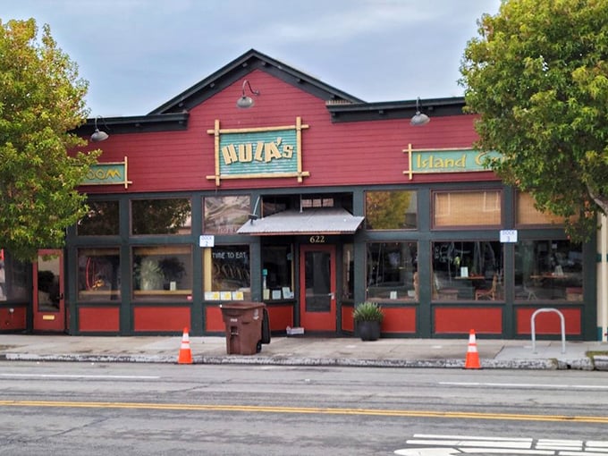That cheerful red building practically radiates island vibes - you can almost hear the ukuleles from the parking lot. 