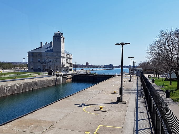 Sault Ste. Marie's historic locks – where massive freighters perform a gravity-defying dance between Great Lakes.