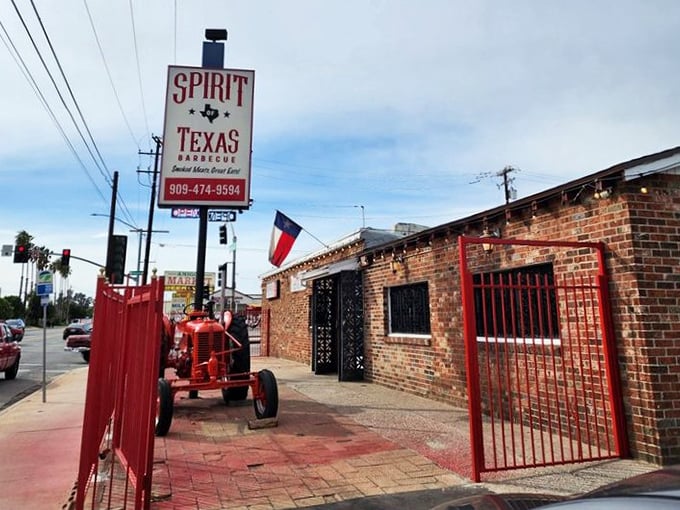Spirit of Texas BBQ announces itself with all the subtlety of a Texas longhorn—and delivers just as much impact. That vintage tractor isn't decoration; it's a philosophy about doing things the old way.