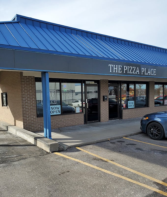 THE Pizza Place keeps it refreshingly simple—blue roof, brick walls, and pizza worth driving across Blue Springs to devour.