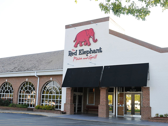 The Red Elephant: That cheerful red elephant isn't just cute – it's pointing the way to pizza happiness.