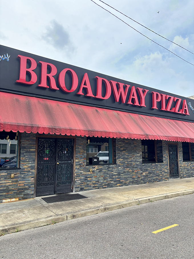 That classic stone facade with the bright red sign has been Broadway Pizza's trademark for generations of Memphis diners.