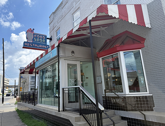 Those cheerful red stripes practically wink at passersby, promising milkshakes thick enough to bend spoons.