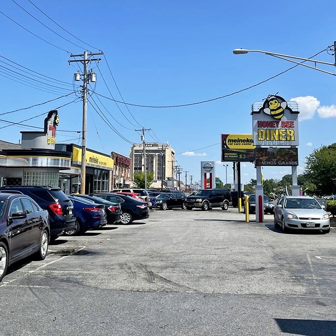 Honey Bee Diner (parking lot view): "A hive of breakfast activity where the honey of hospitality flows freely and the coffee is always buzzing with flavor."