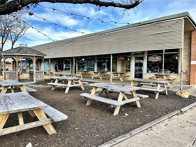 Those wooden picnic tables aren't just seating—they're front-row tickets to one of Austin's best sandwich shows.