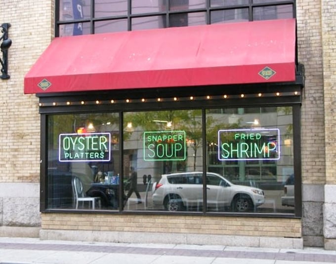 Pearl's Oyster Bar (window display): "Those neon signs aren't lying—the oyster platters and snapper soup inside are worth stopping for!"