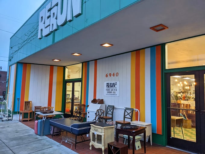 Vintage furniture waits patiently outside Rerun for its next adventure. That end table has stories to tell—if only it could talk!