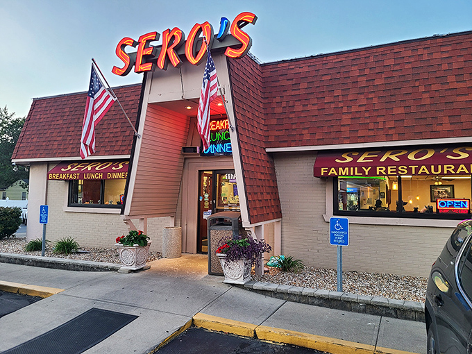 American flags frame the entrance to this beloved local institution where comfort food comes with a side of patriotism.