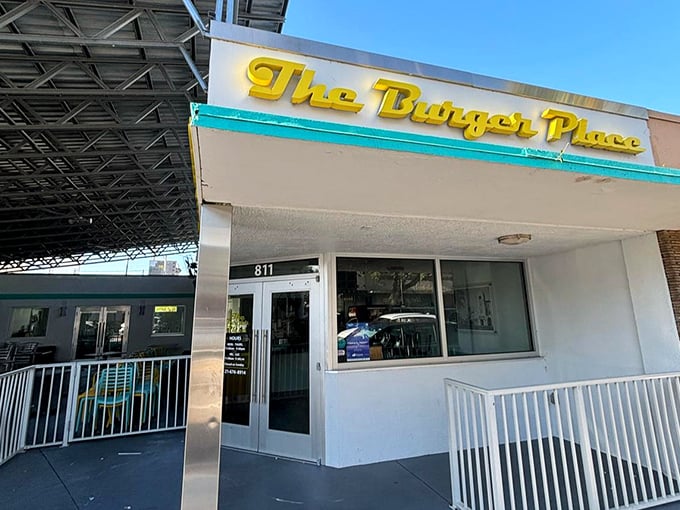 A closer view of The Burger Place reveals its straightforward approach. That burger sign isn't just decoration—it's a promise.