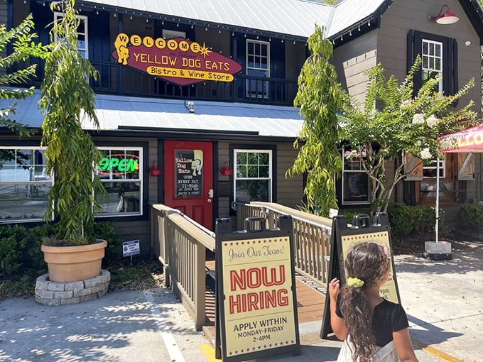 The inviting entrance to Yellow Dog Eats promises a unique experience. "Now Hiring" – they might need help handling all those hungry customers!